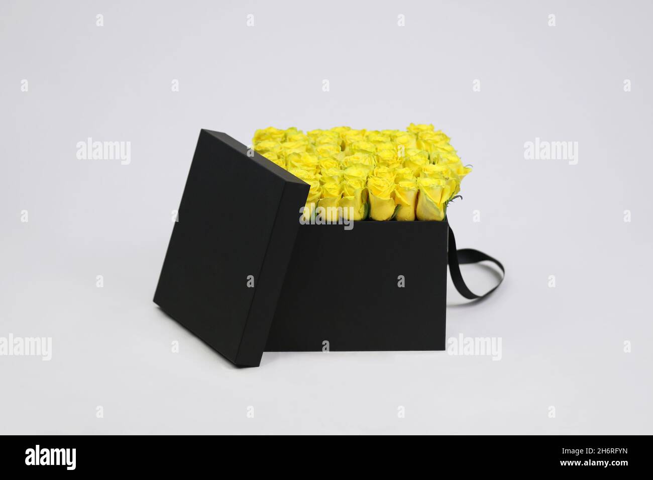 Black square gift flower packaging box with yellow roses inside and ...