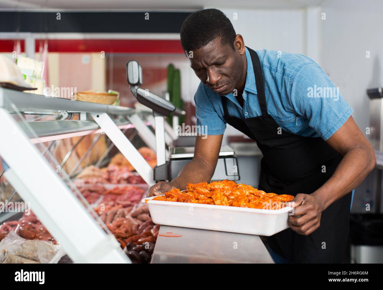 Butchers preparing minced meat hi-res stock photography and images - Alamy