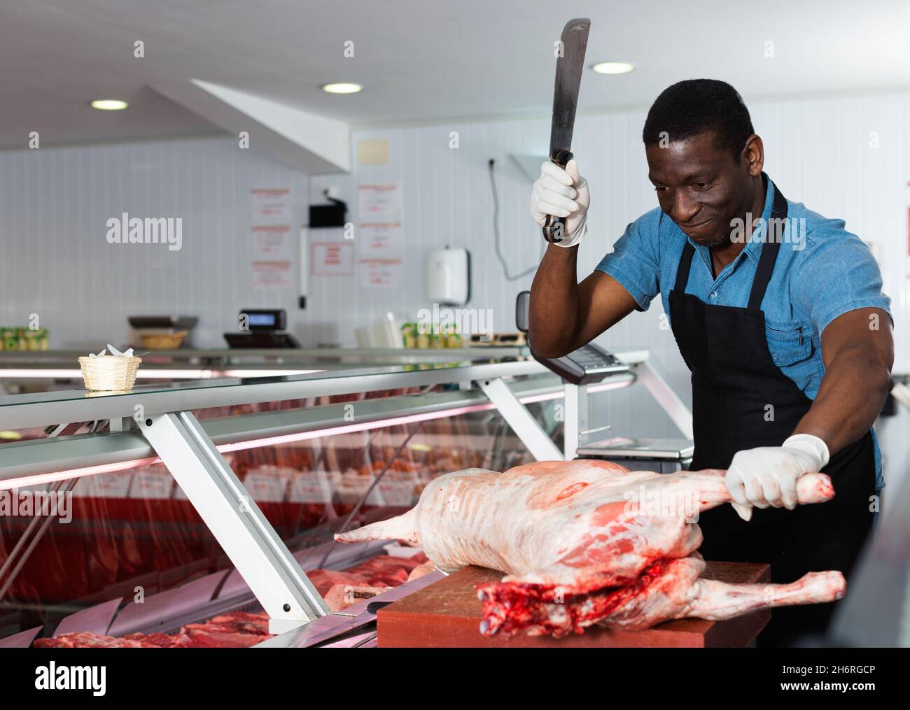 Butcher cutting meat african man hi-res stock photography and images ...