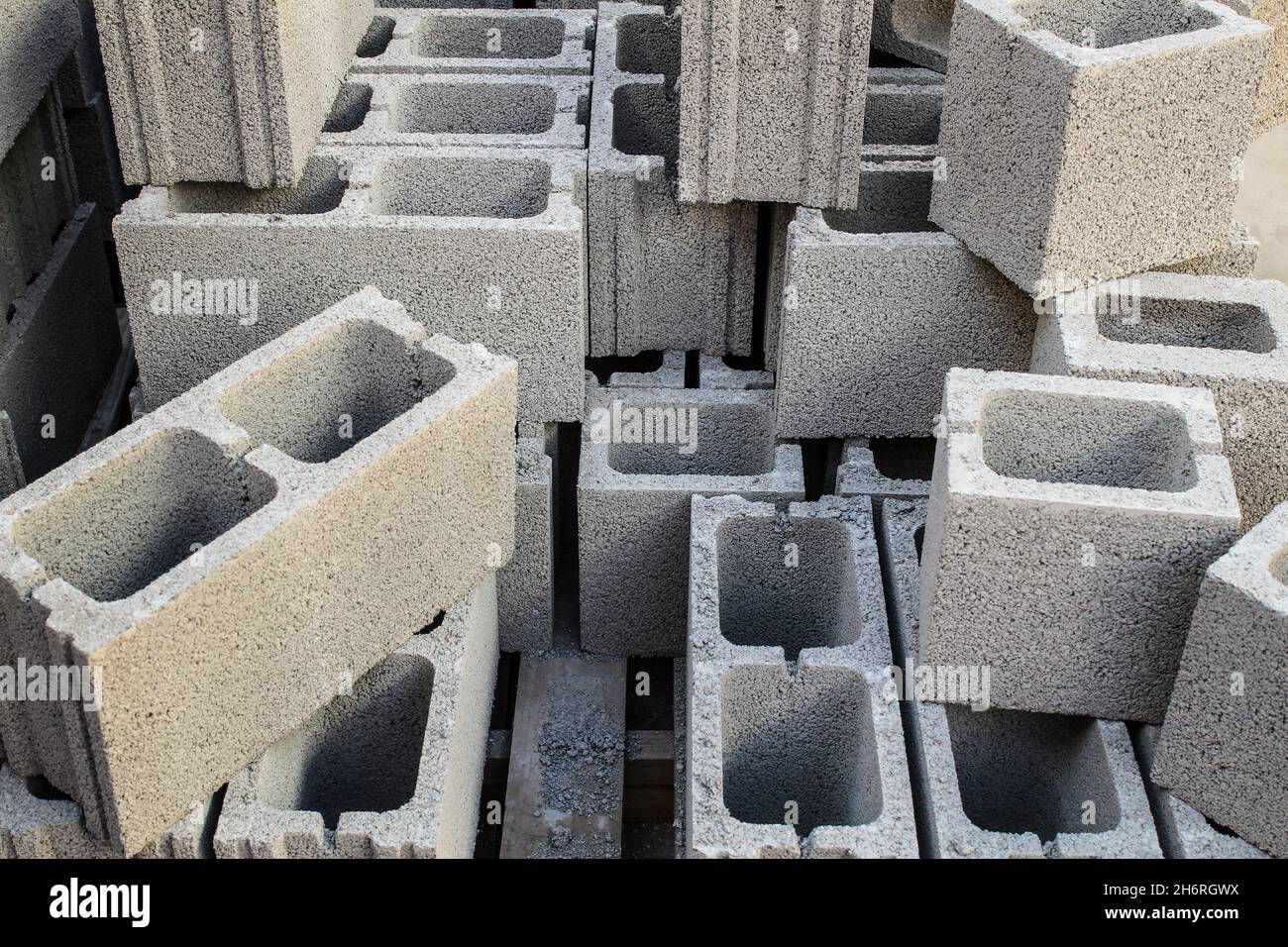 Gray concrete bricks for sale in a warehouse Stock Photo - Alamy