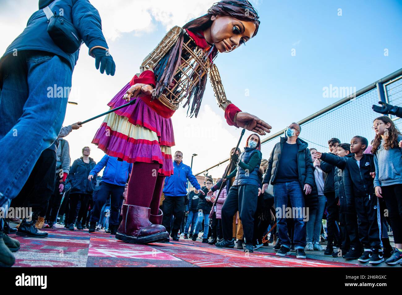 The giant puppet seen looking at a special carpet made for her by a ...