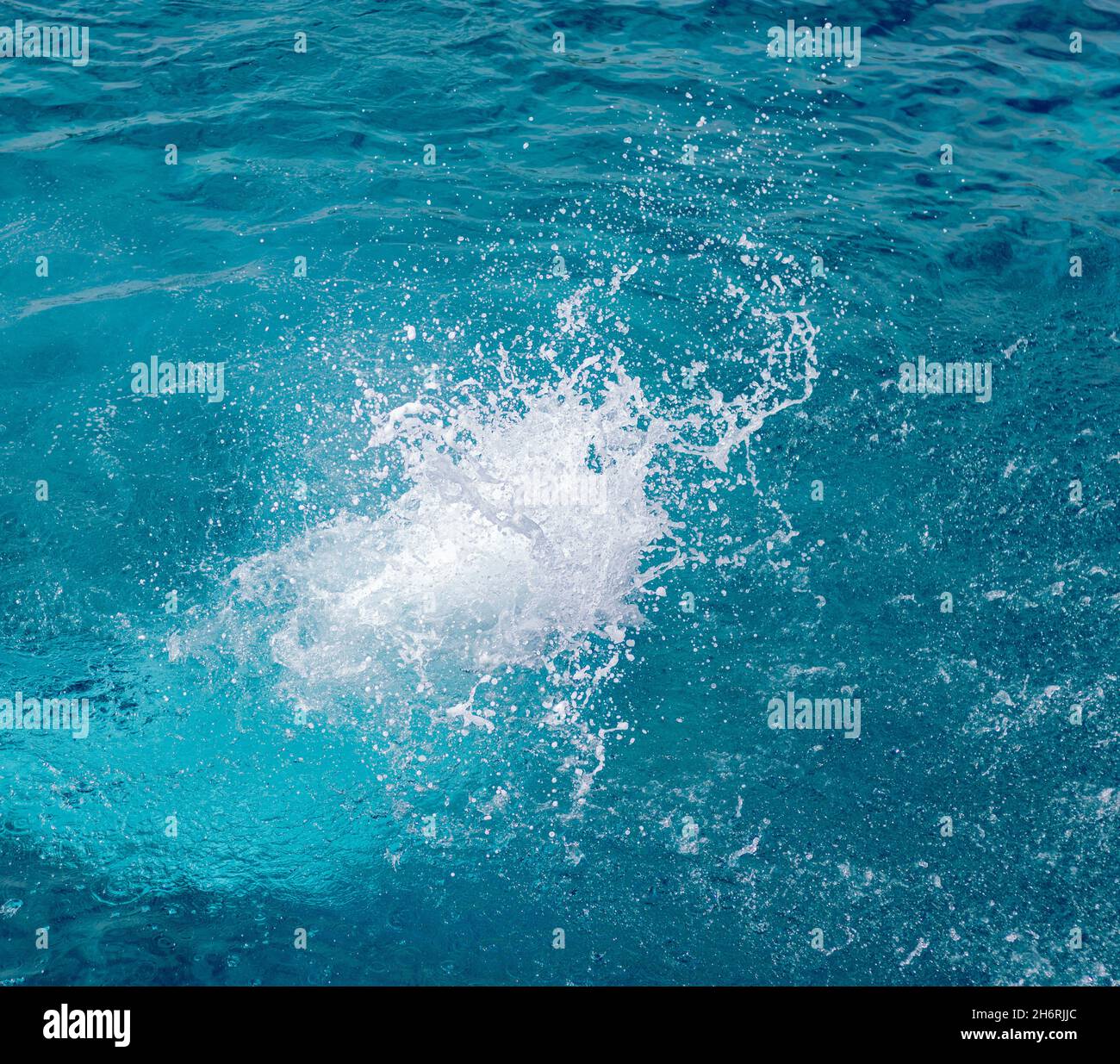 Splashes of blue, sea water with foam bubbles. A splash of nature on a ...