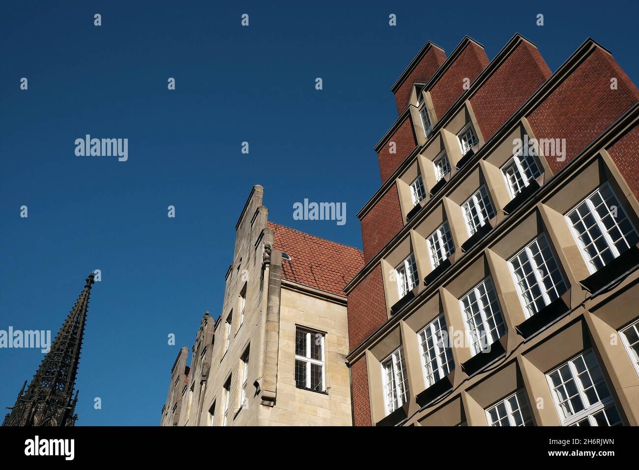 Low angle shot of residential buildings with white windows on a sunny ...