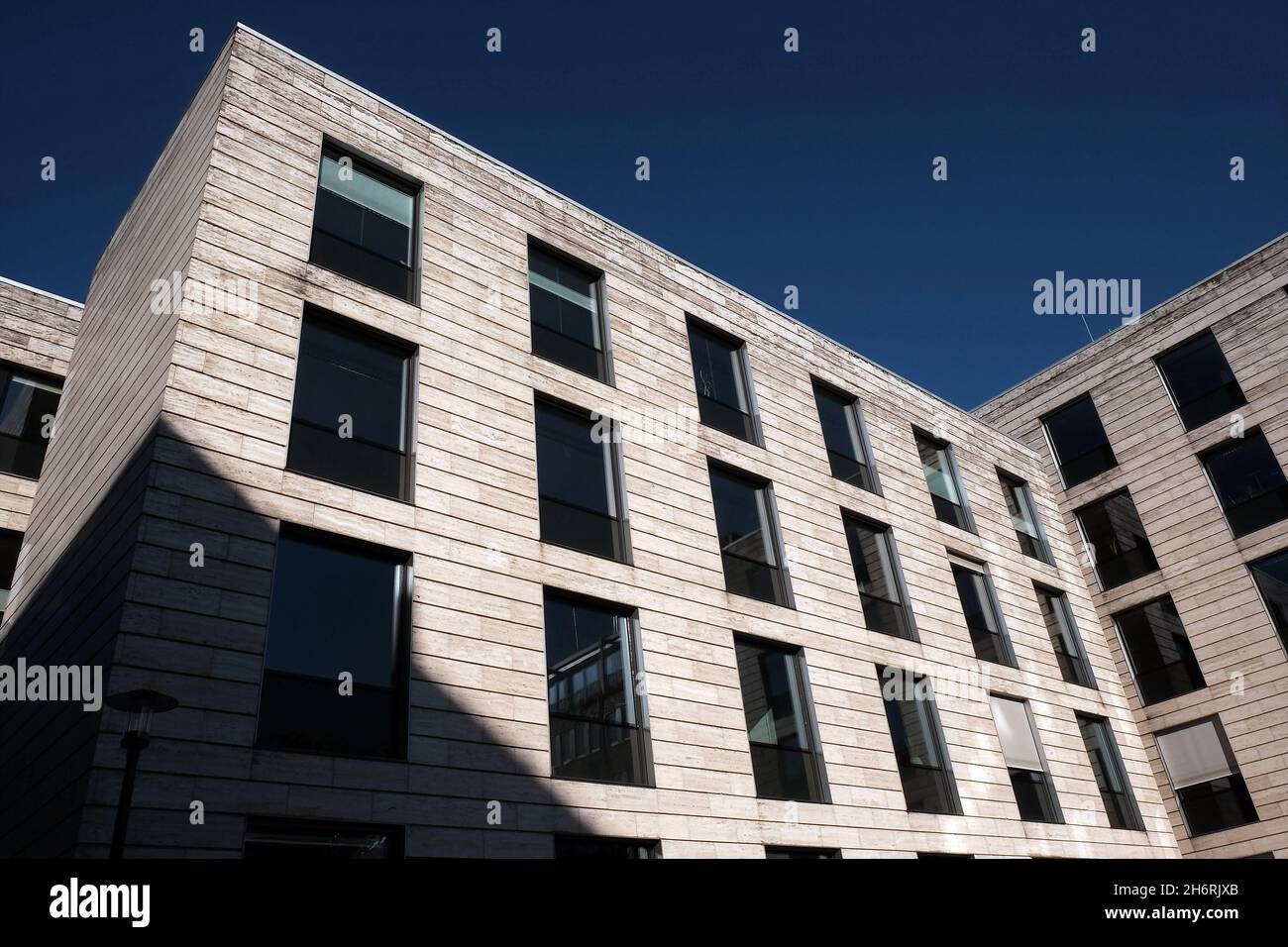 Modern office building with white brick walls on a sunny day in Munster ...