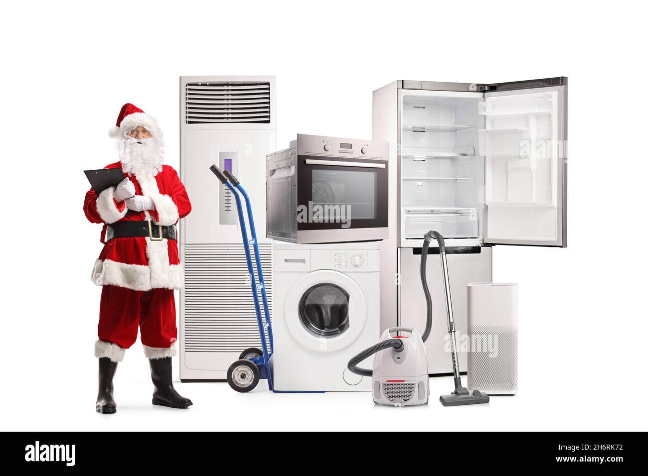 Full length portrait of santa claus holding a clipboard and standing in ...