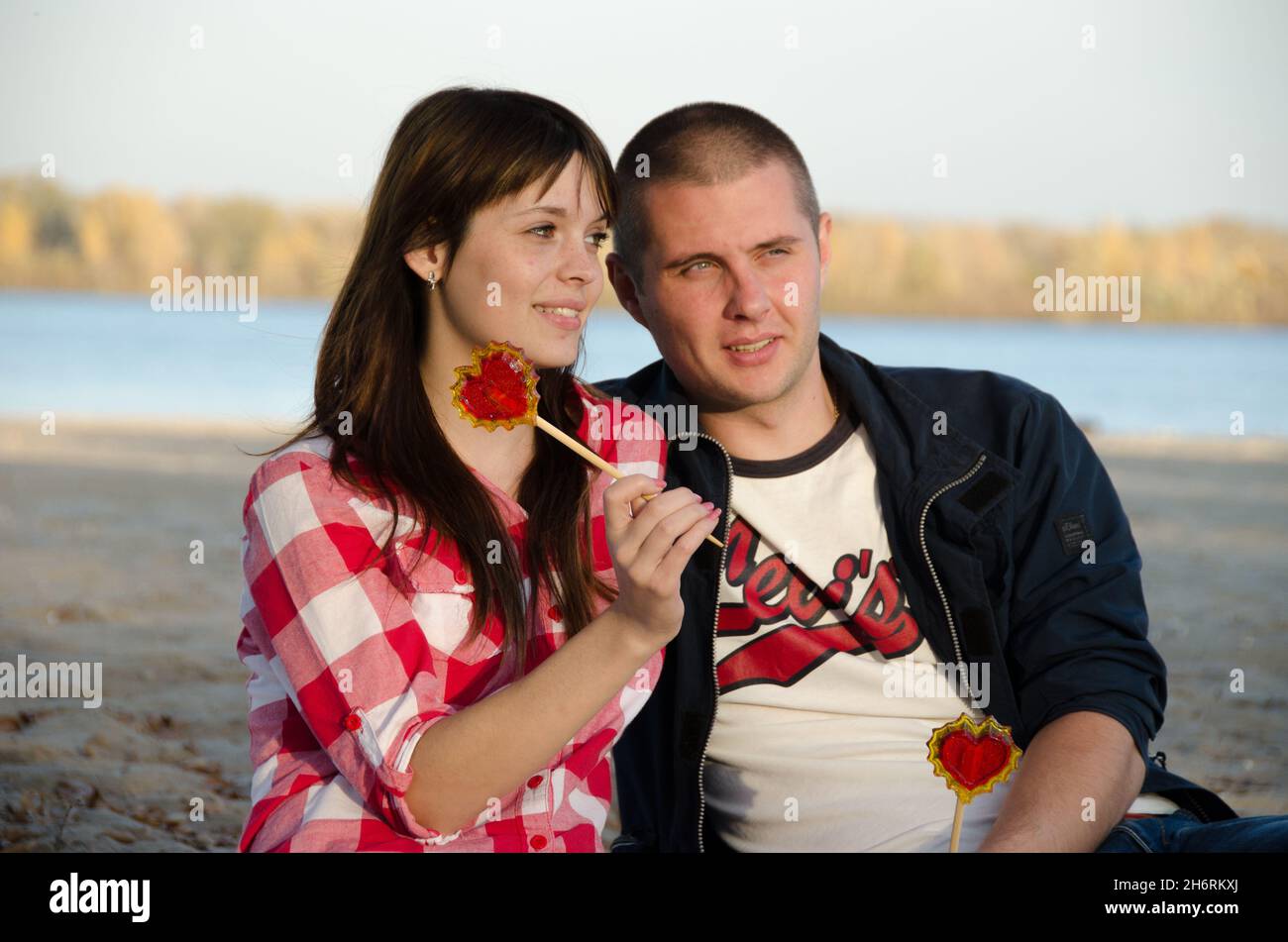 Lovely couple having fun together in nature. The couple are enjoying ...