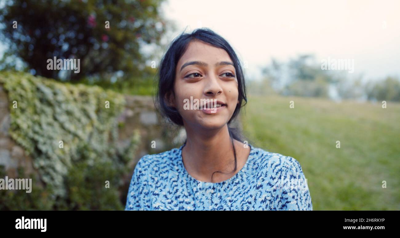 Young attractive Indian girl happily talking Stock Photo - Alamy
