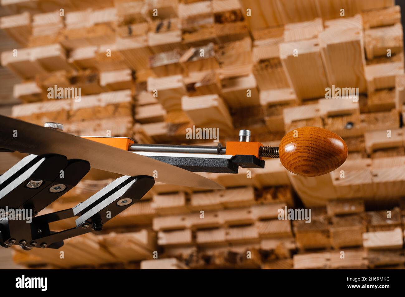 Sharpening knife process using professional sharpener with whetstone in ...