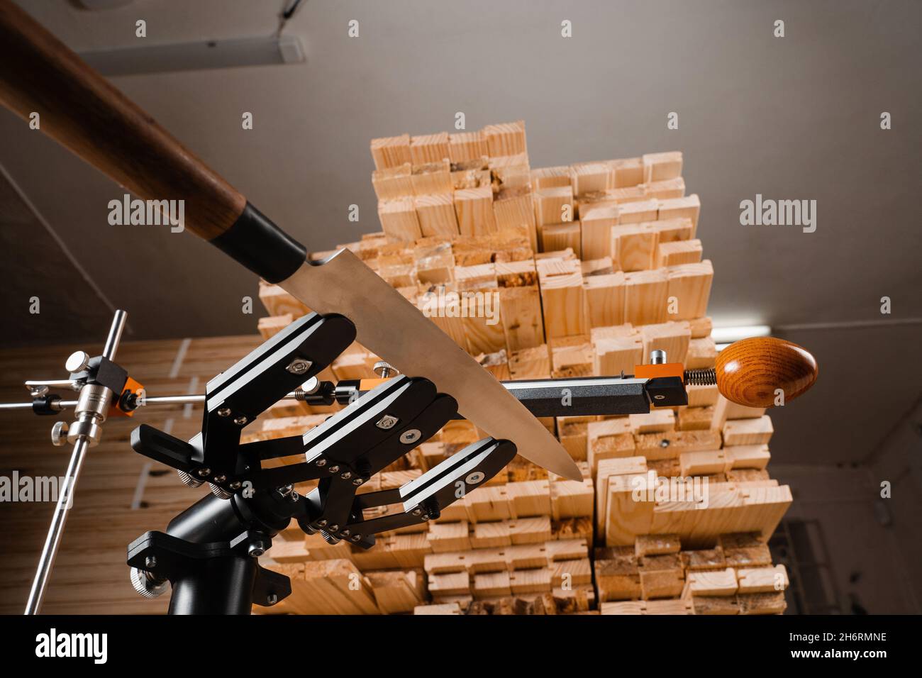 Sharpening knife process using professional sharpener with whetstone in ...