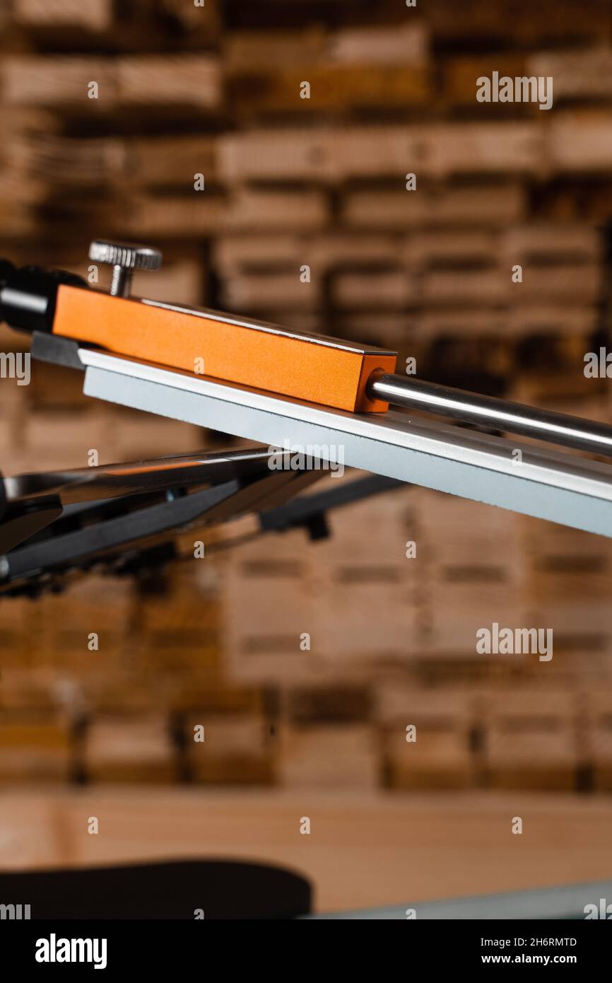 Sharpening knife process using professional sharpener with whetstone in ...