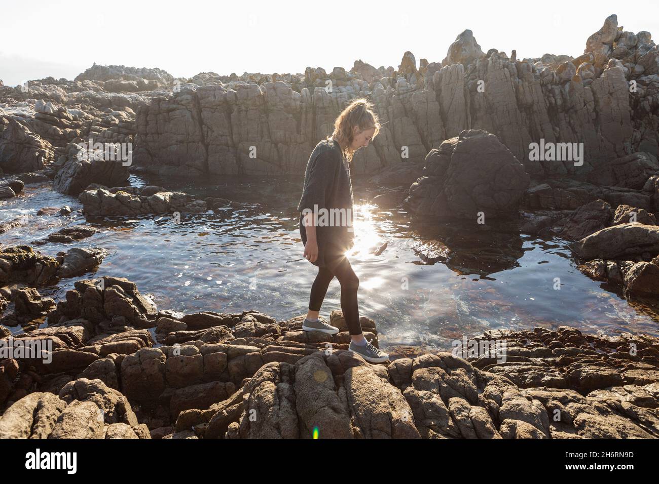 Girl walking over rocks hi-res stock photography and images - Alamy