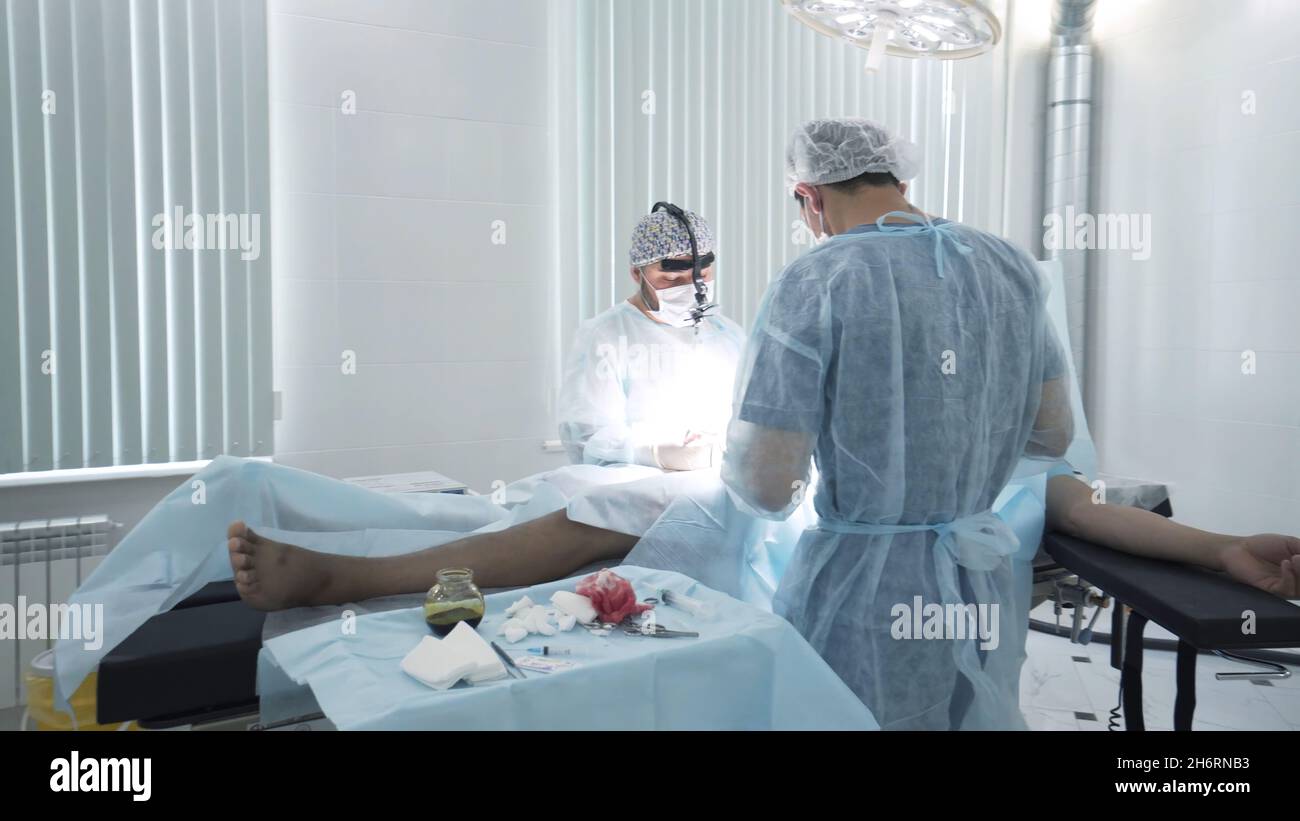 Surgeons perform light abdominal surgery. Action. Professional surgeons ...