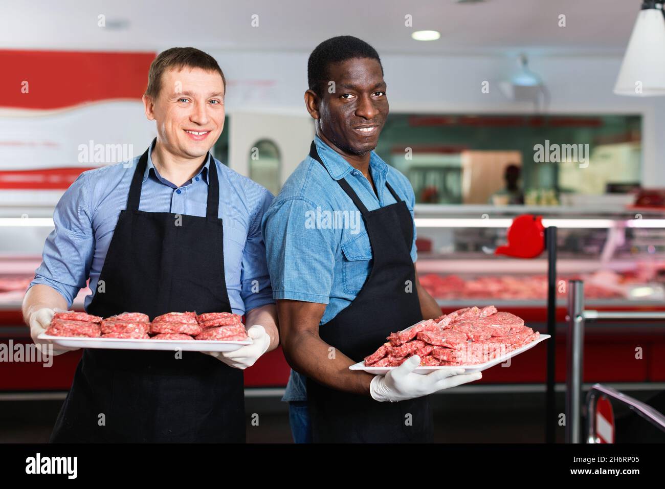 Successful sellers of butcher store offering fresh raw meat steak ...