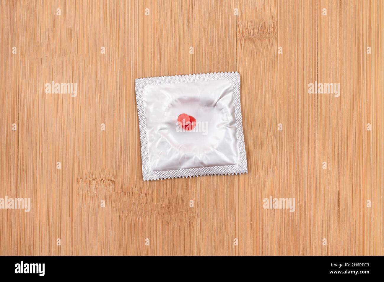 A Joke On Colleagues Freebie Or A Defective Condom Packaged Latex Condom Pinned To A Wooden