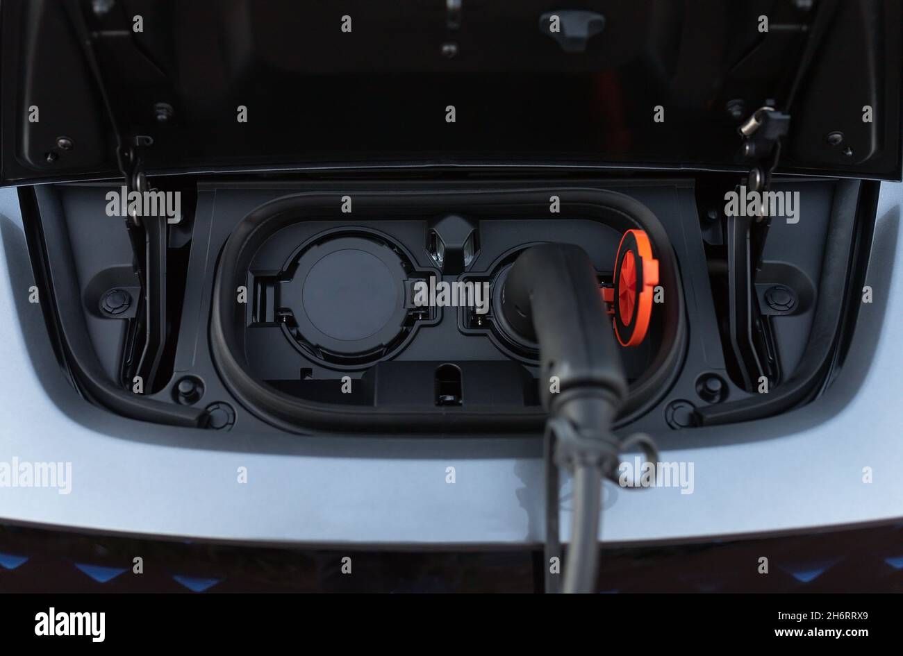Detail of open charging port door with charging plug connected Stock ...