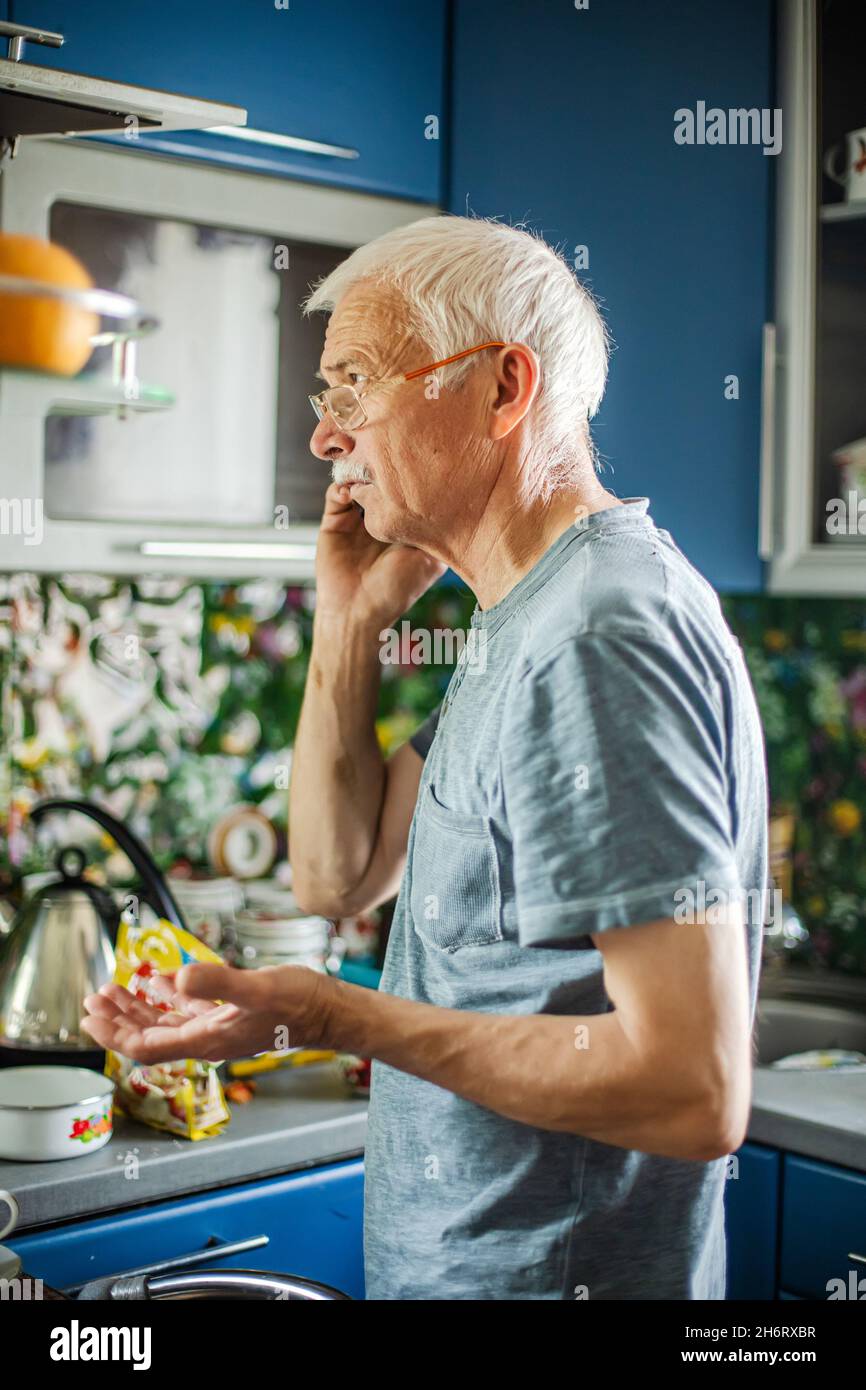 Old man with gray hair and a mustache, of the baby boomer generation ...