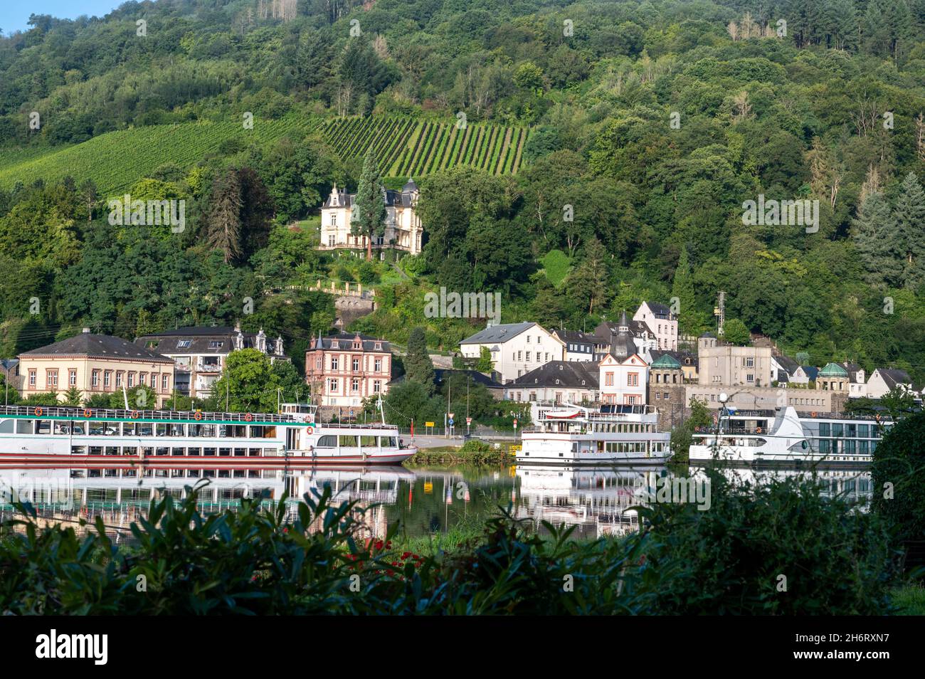 View on Mosel river, hills with vineyards and old town Traben-Trarbach ...