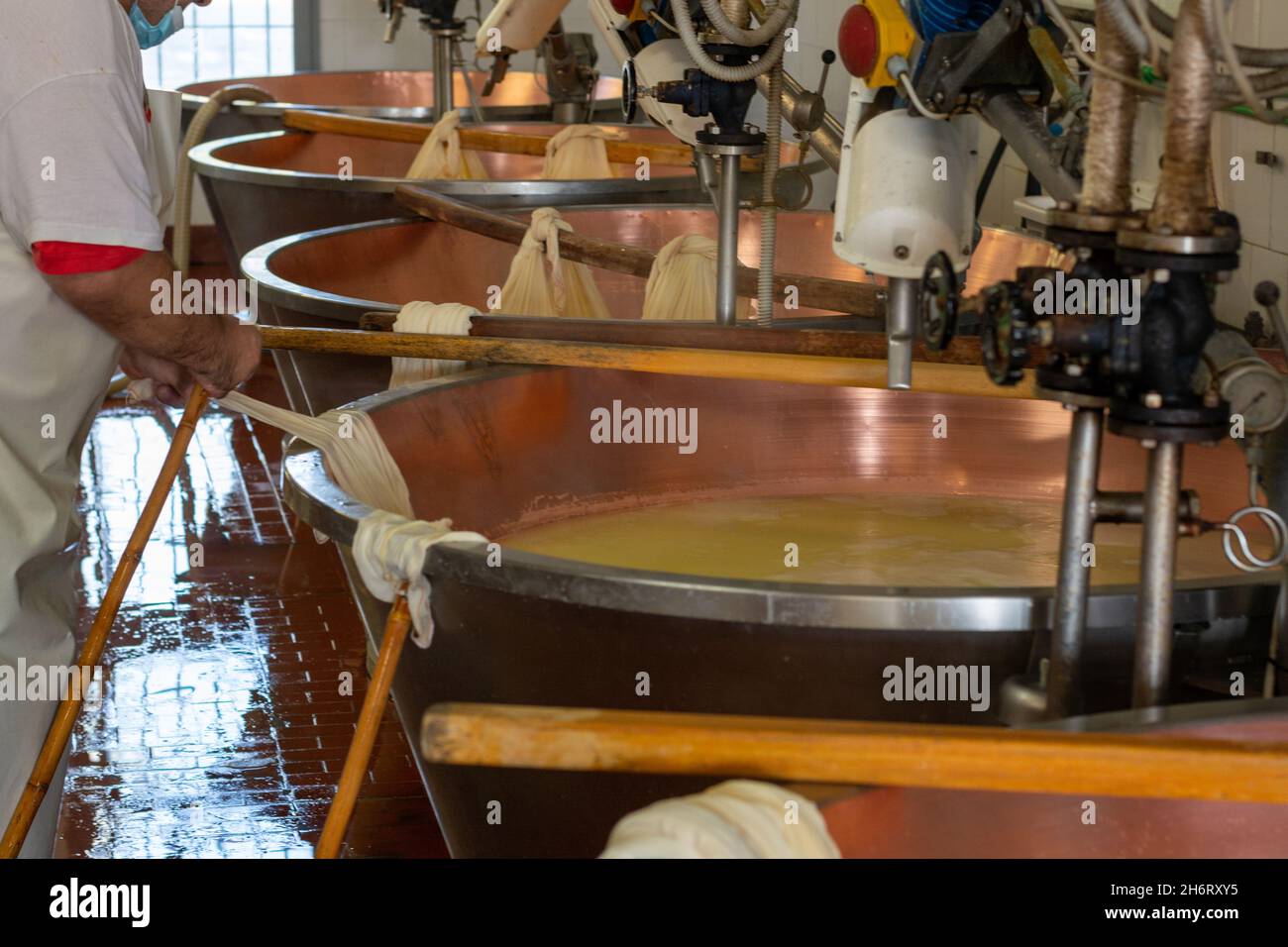Traditional process of making from cow milk wheels of parmigiano ...
