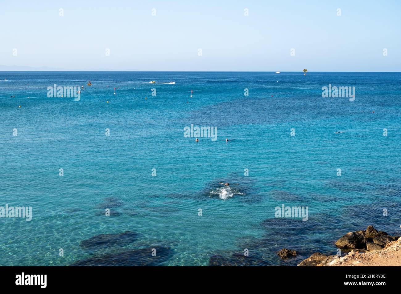Crystal clear sea water in small rocky bay near Fig tree beach in ...