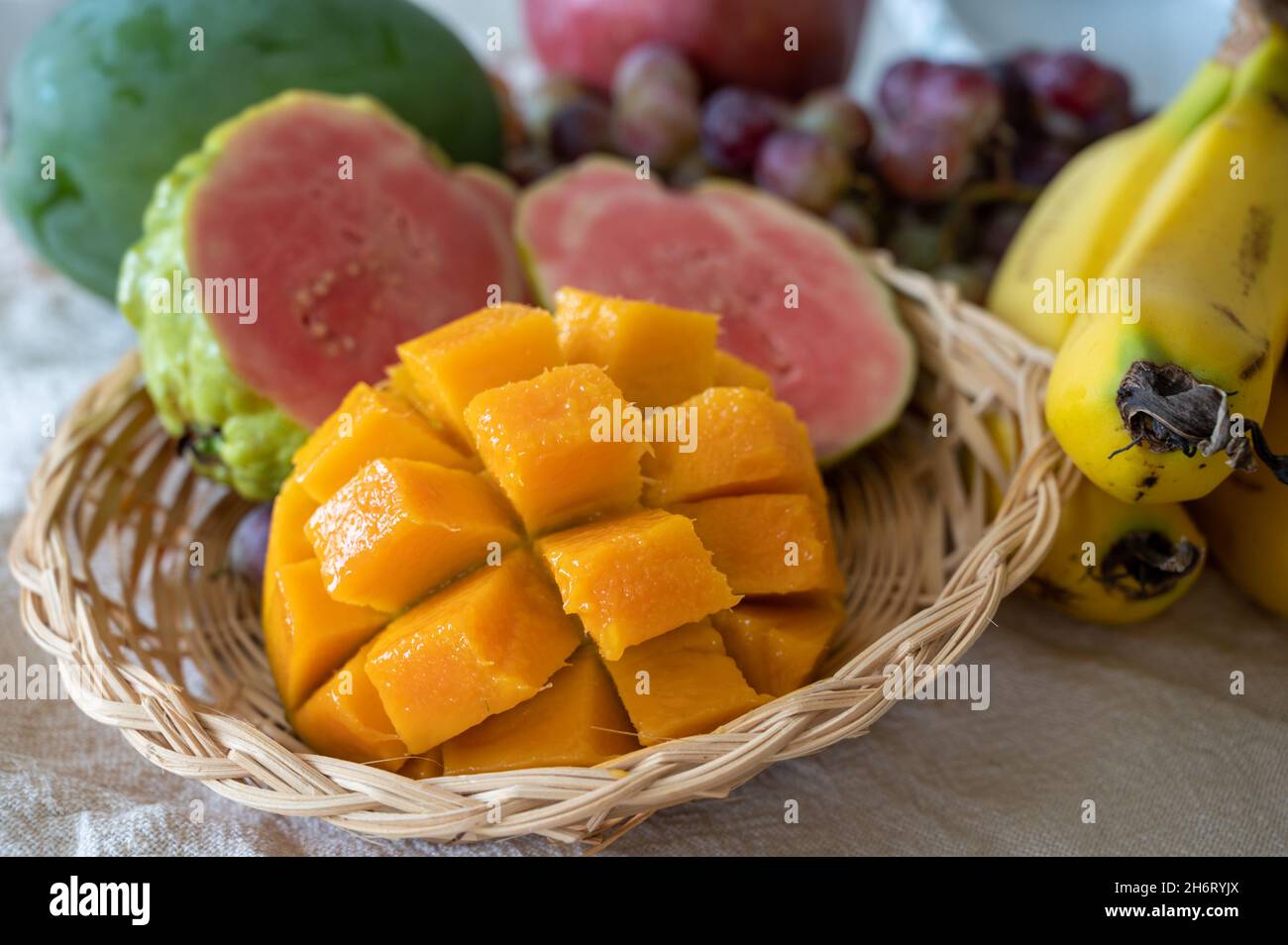 Exotic fruits of Cyprus, fresh yellow juicy mango, ripe pink guava ...