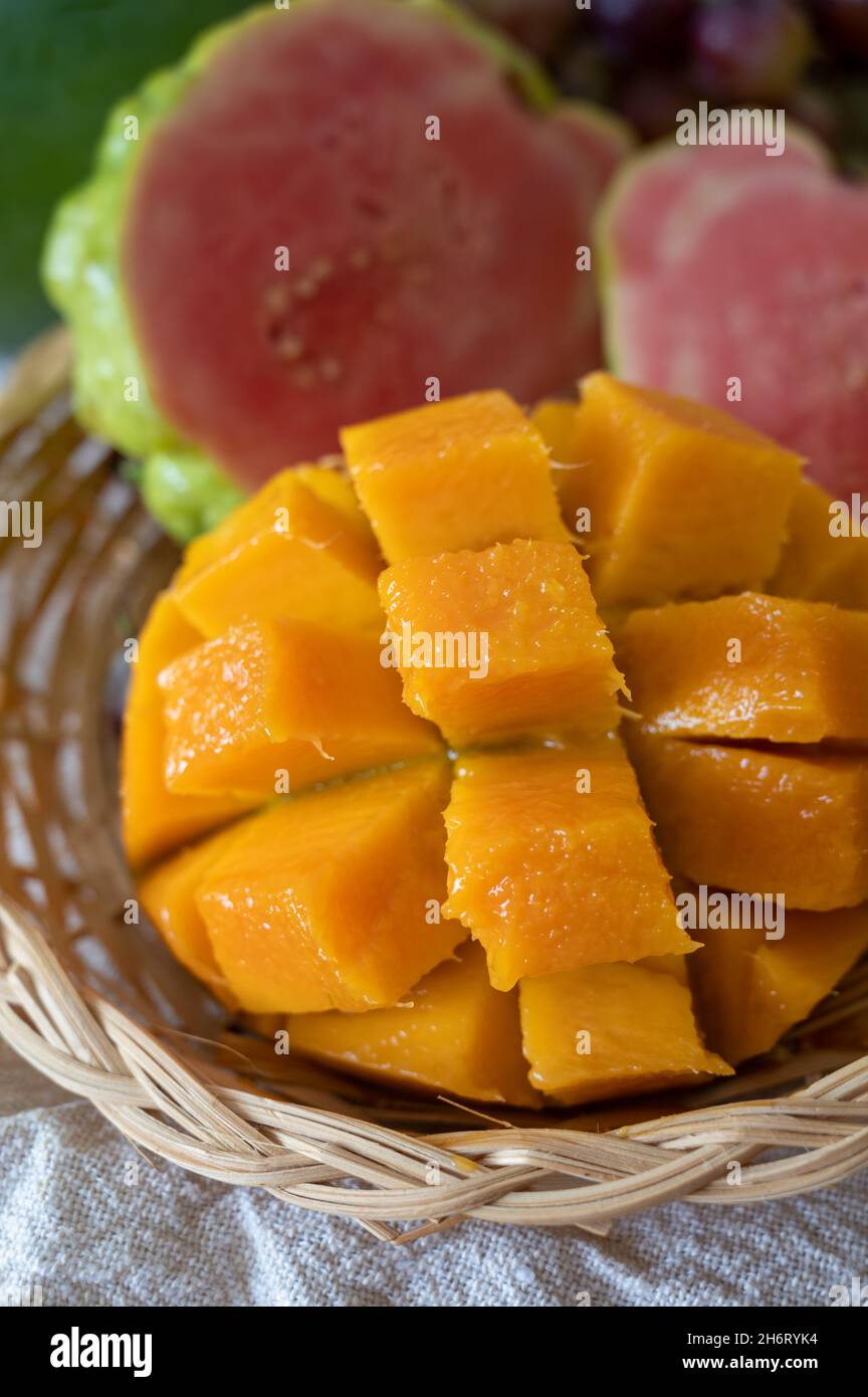 Exotic fruits of Cyprus, fresh yellow juicy mango, ripe pink guava ...