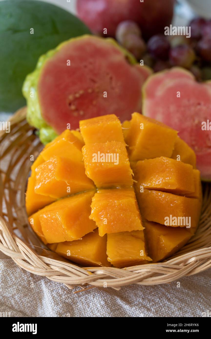 Exotic fruits of Cyprus, fresh yellow juicy mango, ripe pink guava ...