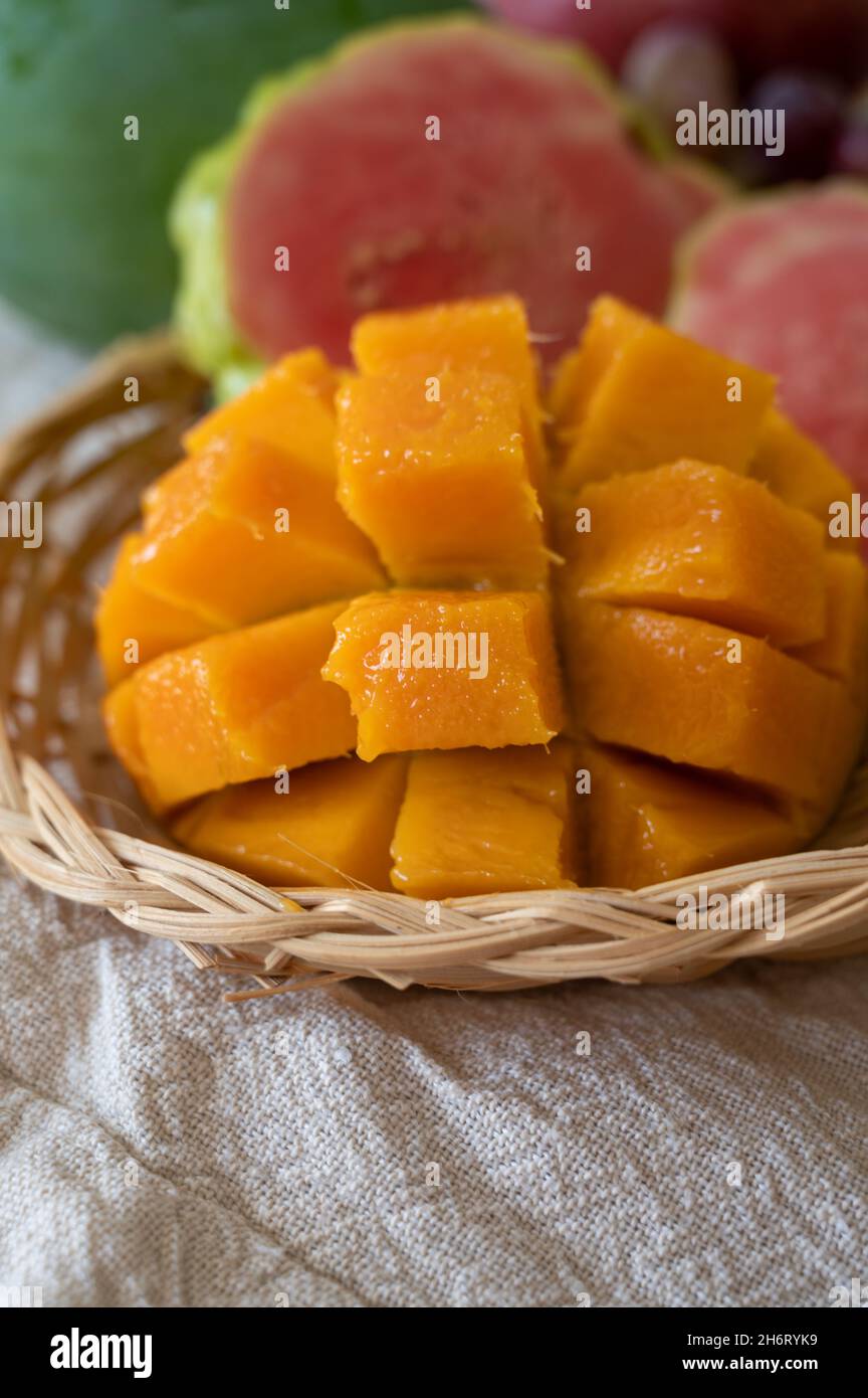 Exotic fruits of Cyprus, fresh yellow juicy mango, ripe pink guava ...