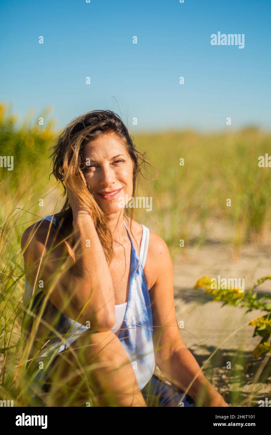 Confident woman on the beach Stock Photo - Alamy