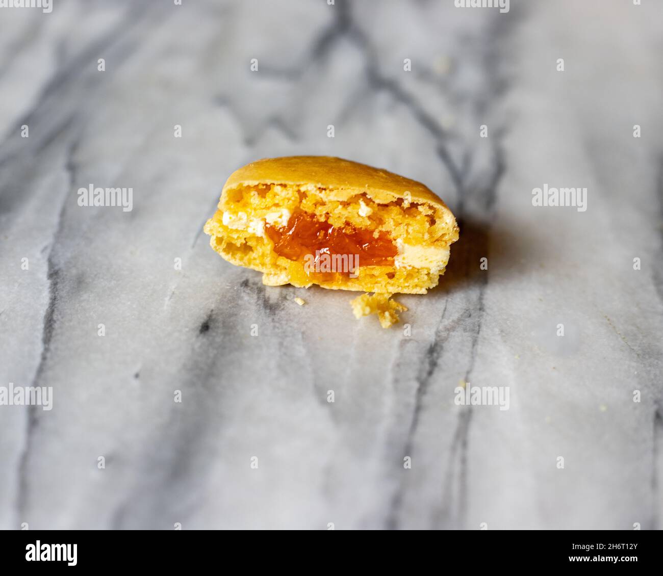Mango Macaron Cross Section on White Marble Stock Photo - Alamy