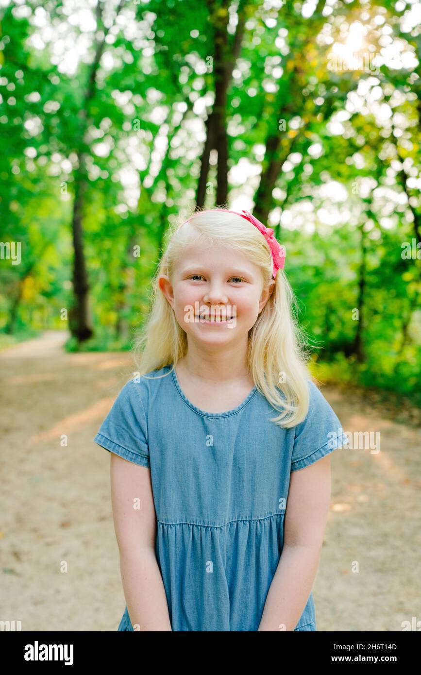 Closeup portrait of a happy young girl on a hiking trail Stock Photo ...