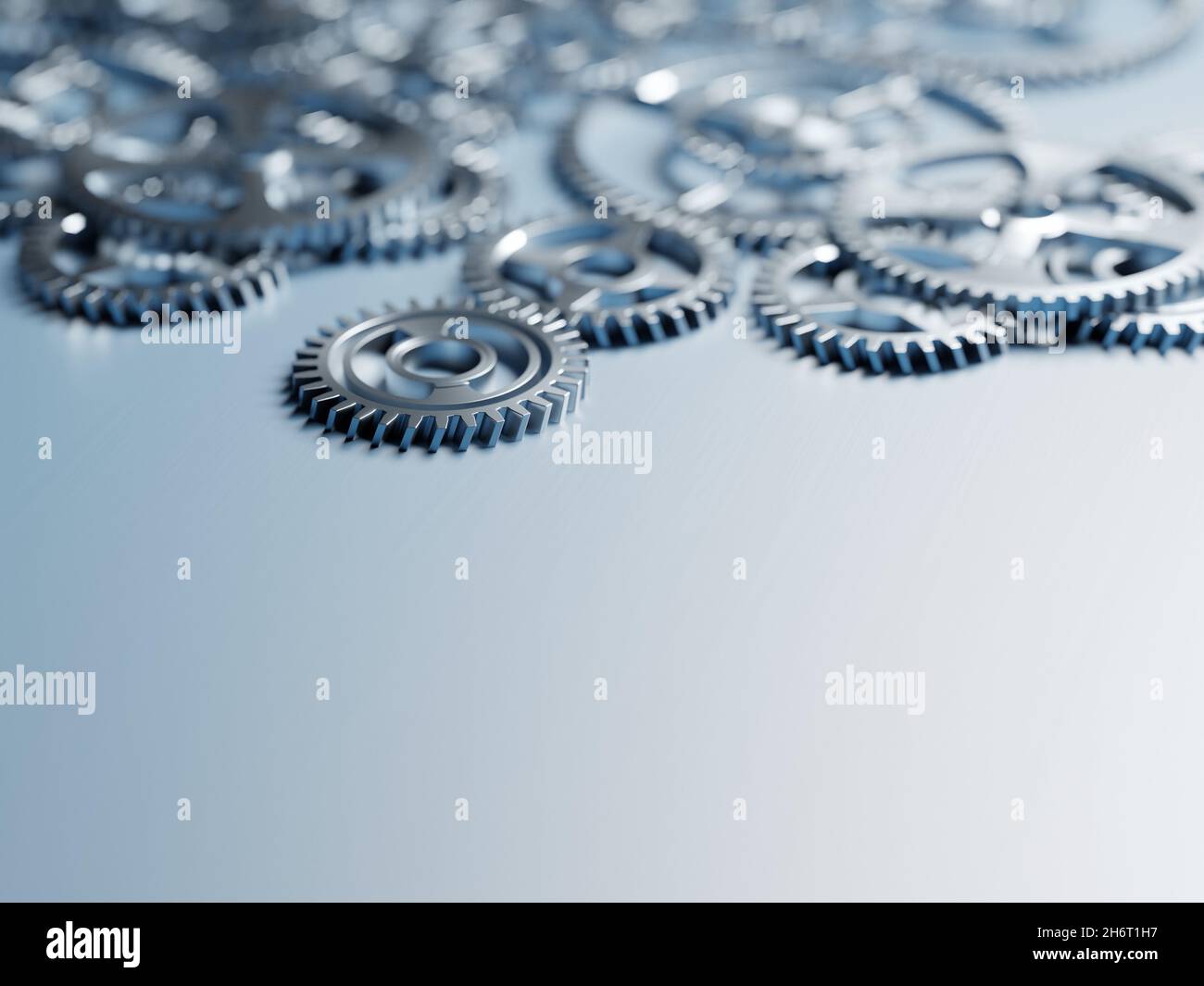 Precision engineering, concept background. Shiny steel gears on light ...