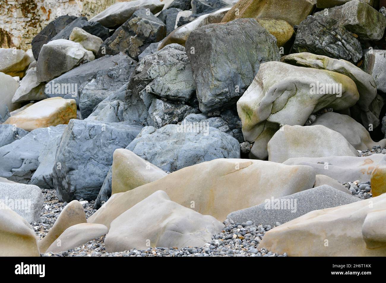 Huge stones on the beach in Normandy Stock Photo - Alamy