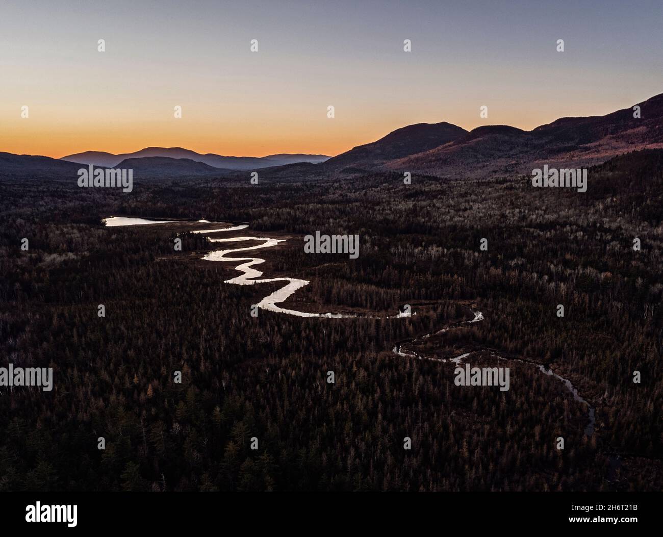 stream meanders through valley at sunset north maine woods Stock Photo ...
