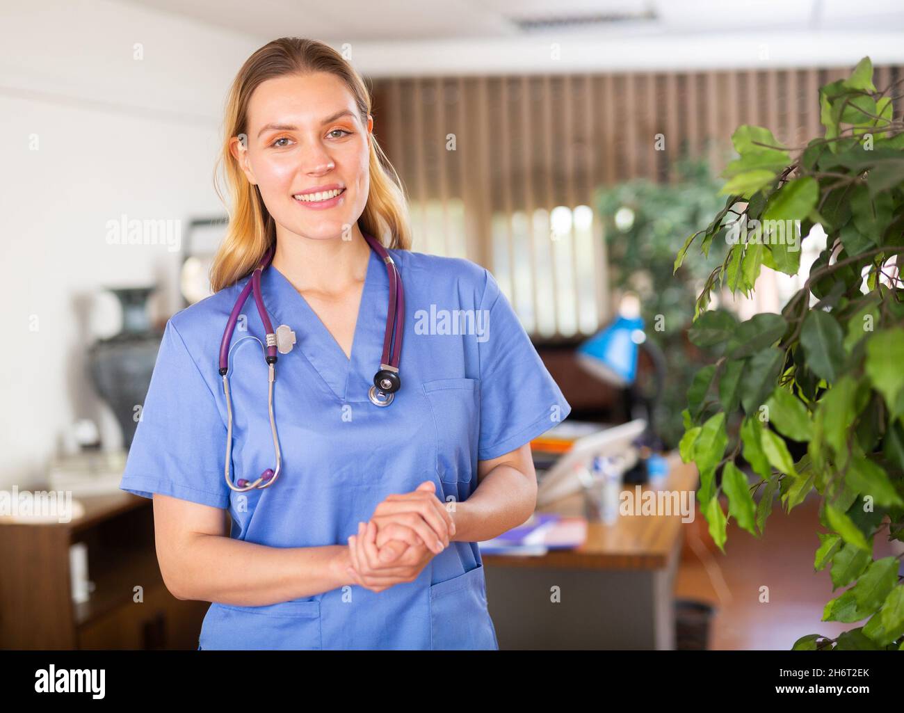 Female doctor assistant standing in medical office Stock Photo - Alamy