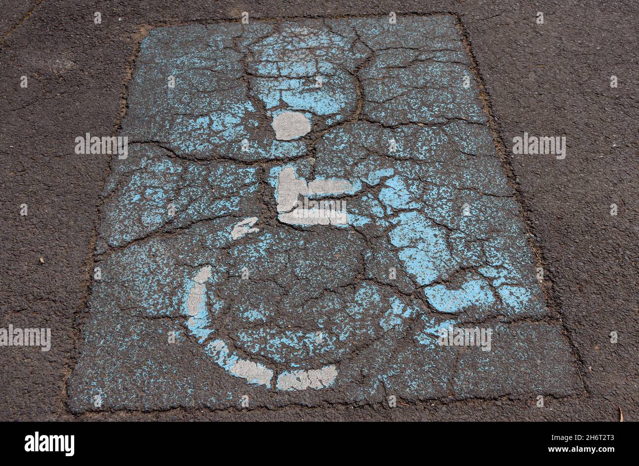 Wheelchair sign on bitumen off car park Stock Photo - Alamy
