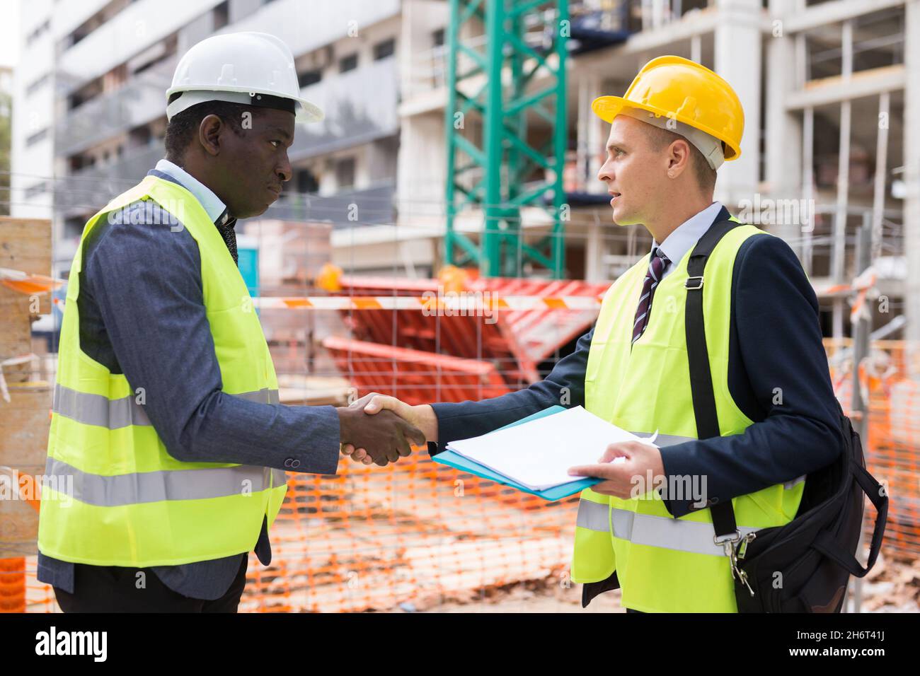 Two successful civil engineers exchange a friendly handshake Stock ...