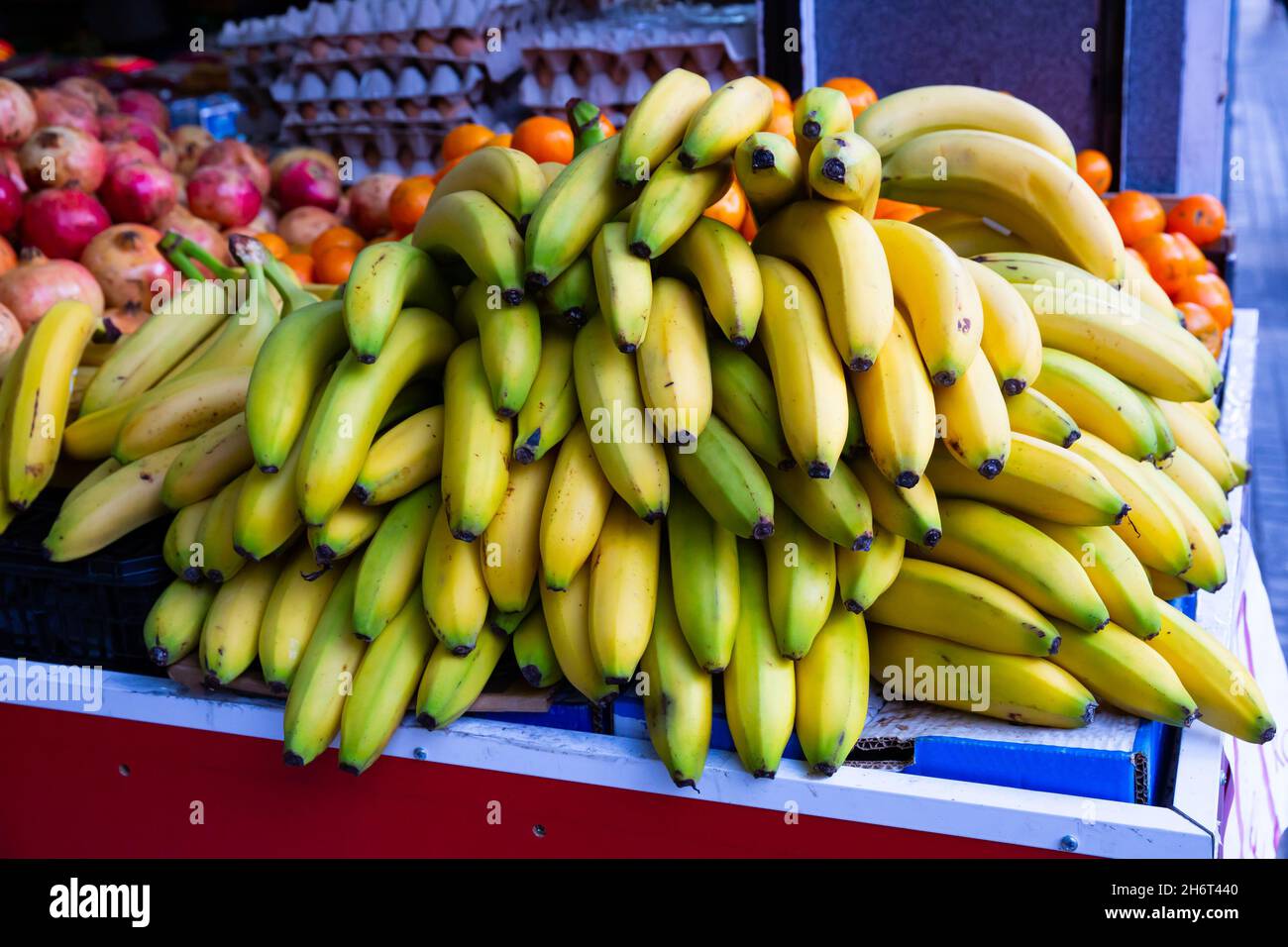 Fresh bananas on counter in food market Stock Photo - Alamy