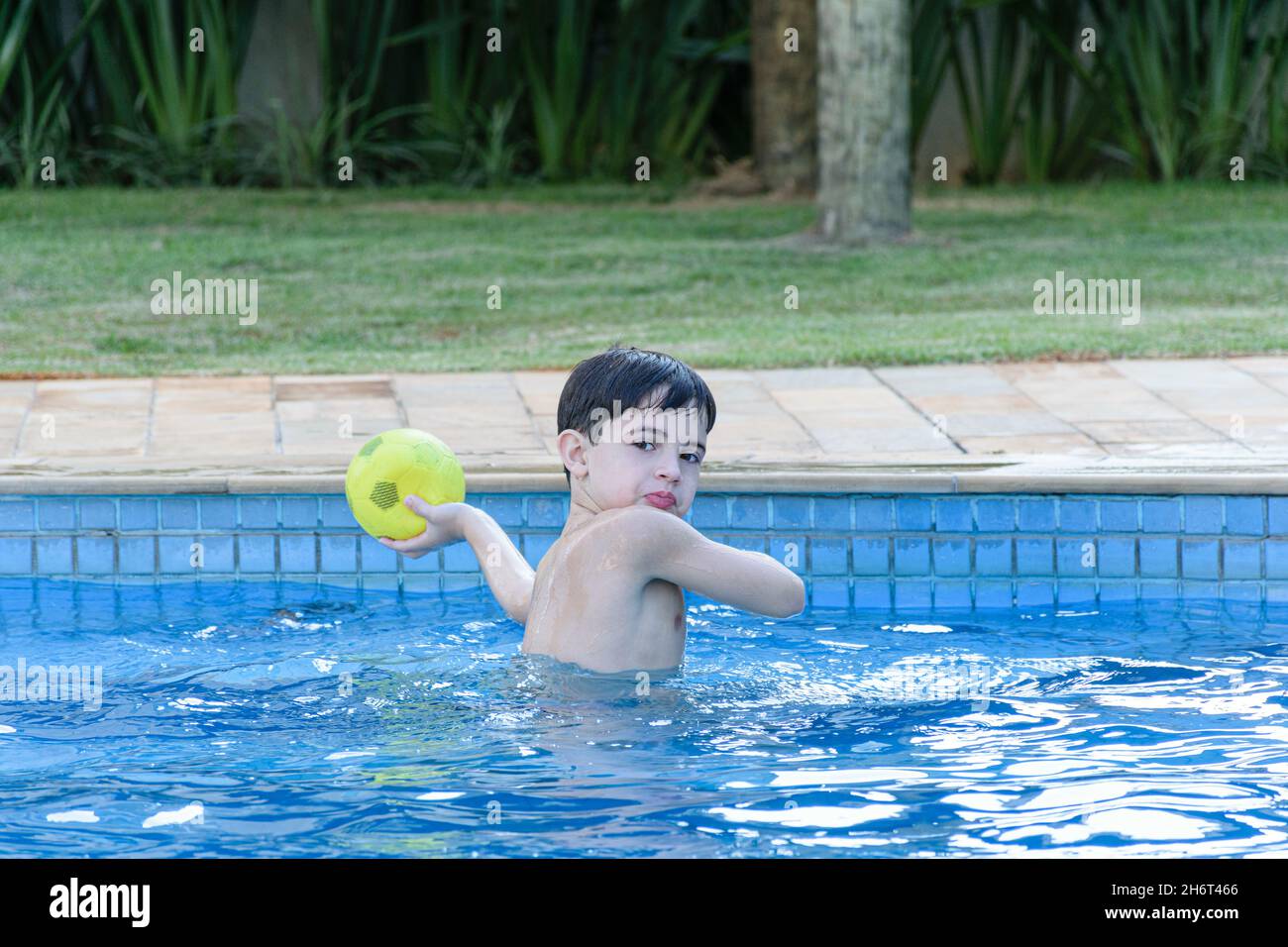 Children throwing ball hi-res stock photography and images - Alamy