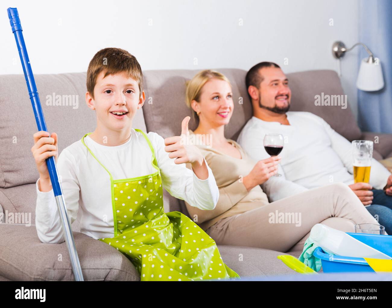 Happy boy dressed for cleaning Stock Photo - Alamy