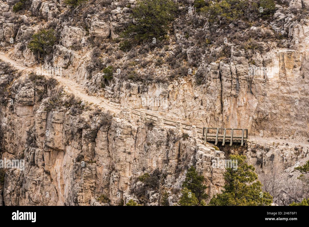 Rocky Trail Leading To Wooden Bridge On Cliffside on the Guadalupe Peak ...