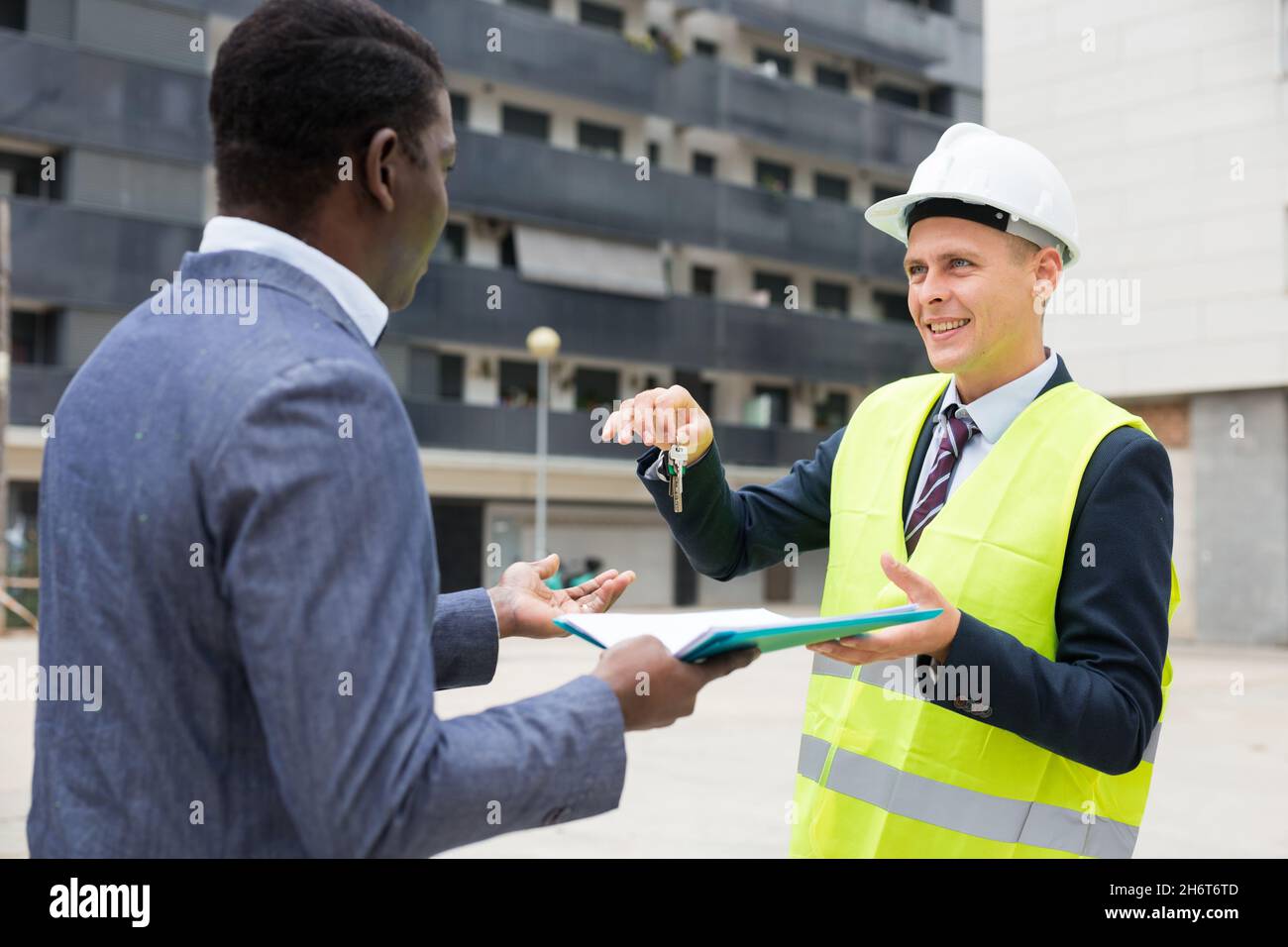 Builder gives the keys to the new home african american businessman ...
