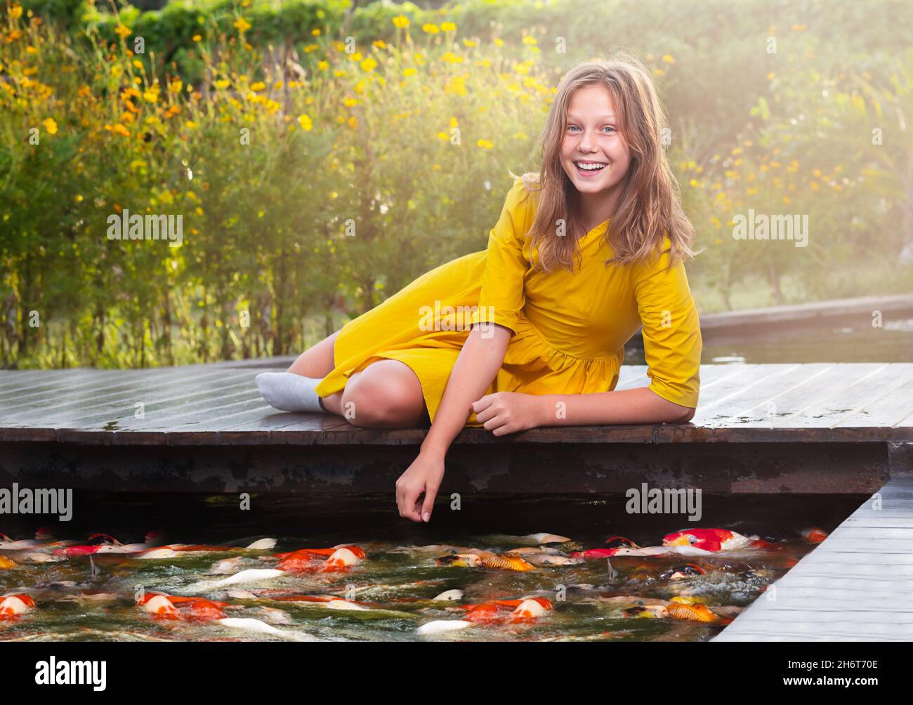 Child and carp hi-res stock photography and images - Alamy