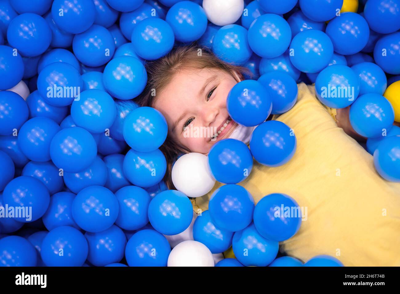 Child playing balls hi-res stock photography and images - Alamy