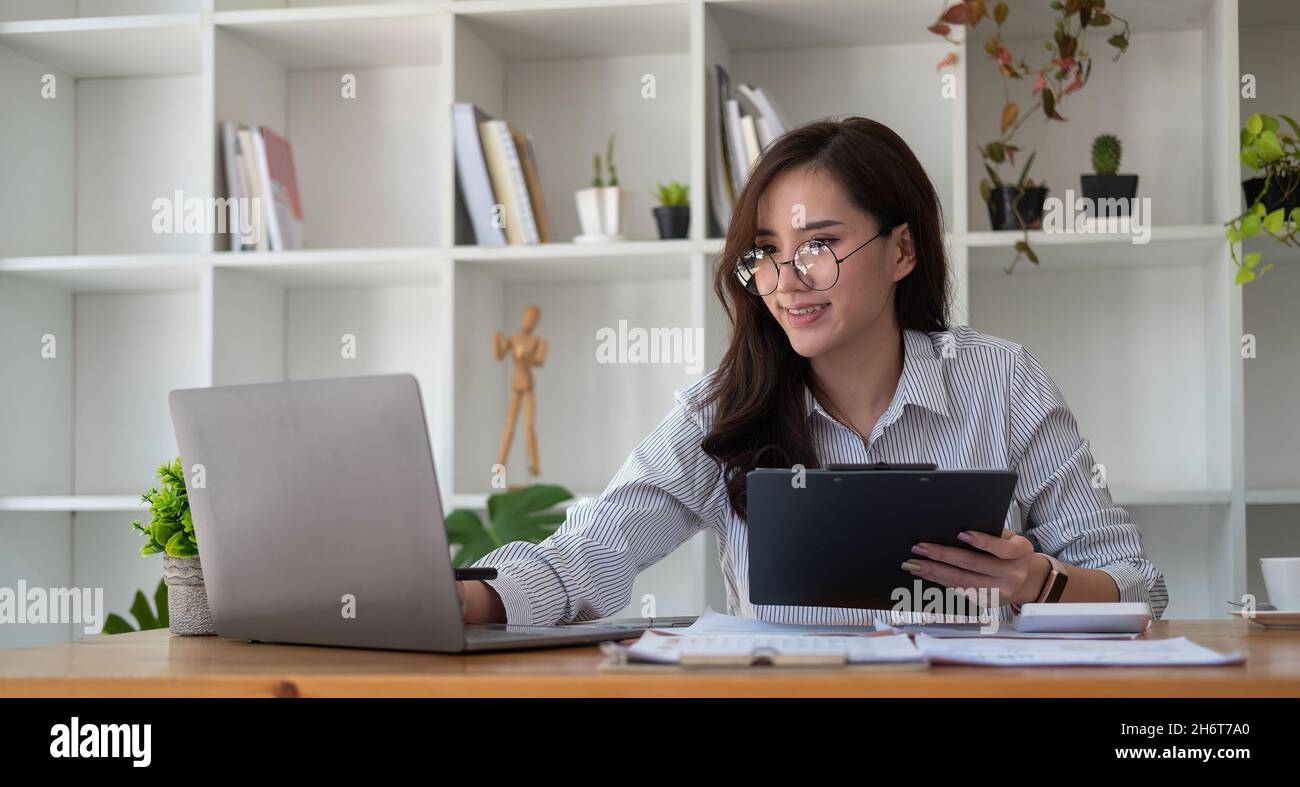 Close up accounting woman working for financial report with laptop and ...
