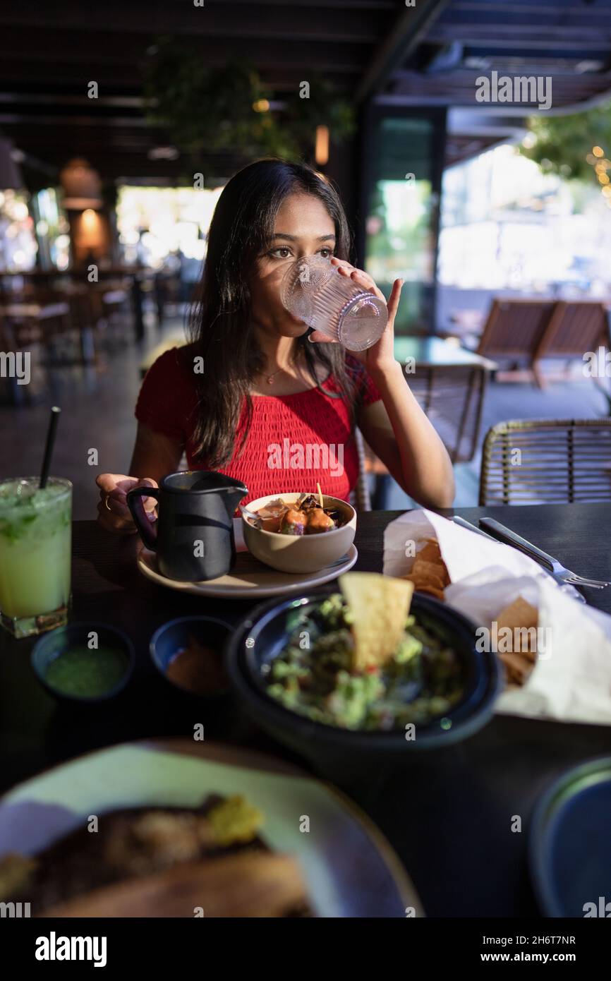 Young Asian Woman Eating Tortilla Soup at a Mexican Restaurant Stock ...