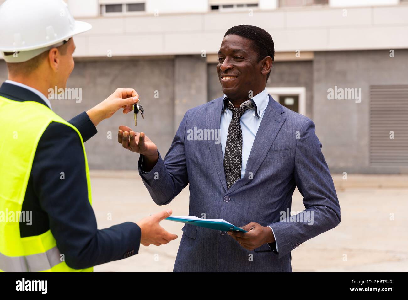 Builder gives the keys to the new home african american businessman ...