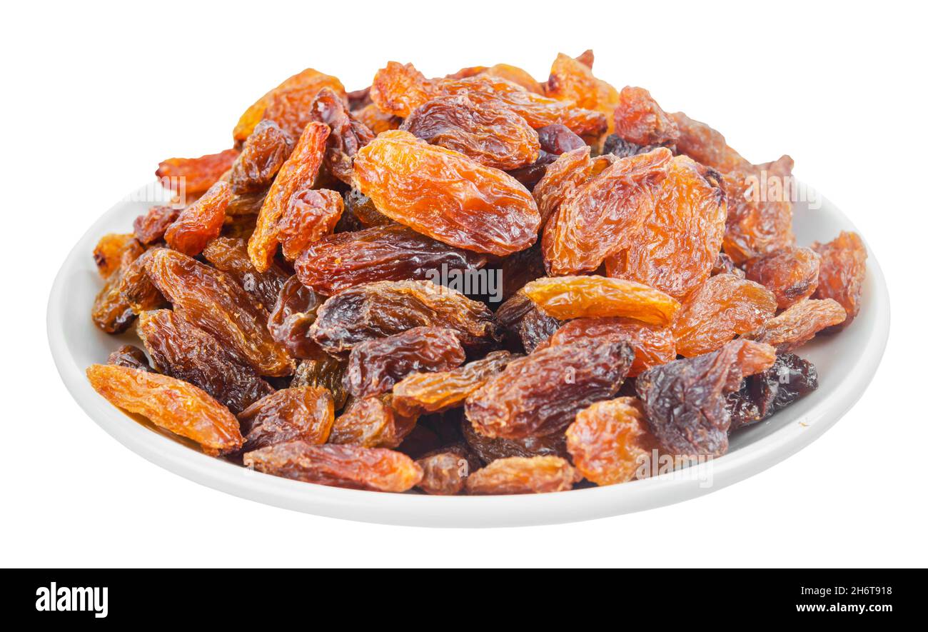 Golden dried raisins in white plate isolated on white background, Save ...