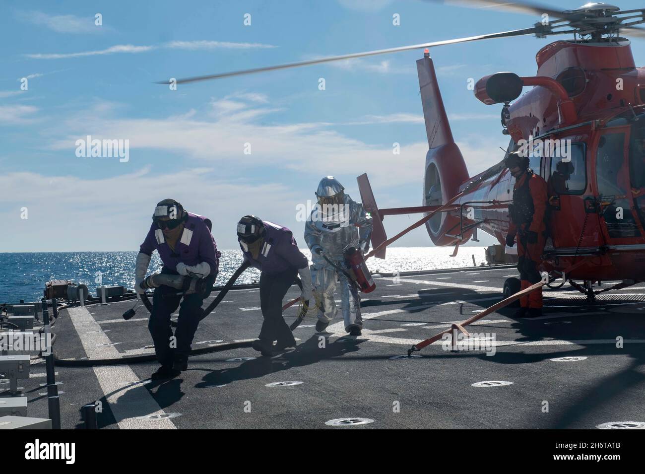 Crew members aboard USCGC Stone (WMSL 758) finish a helicopter ...