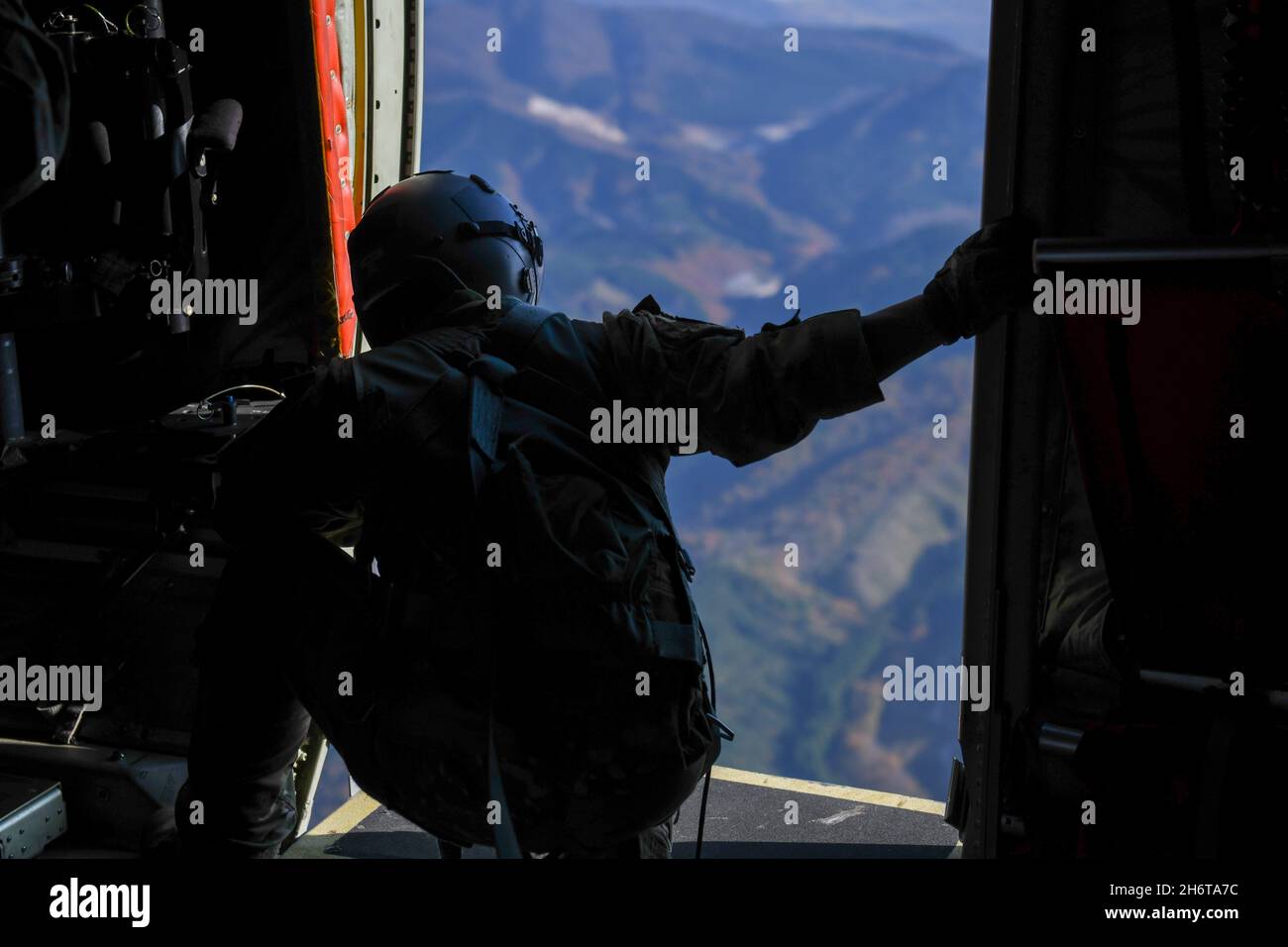 Staff Sgt. Jay-Peter Tuazon, 36th Airlift Squadron loadmaster, watches ...