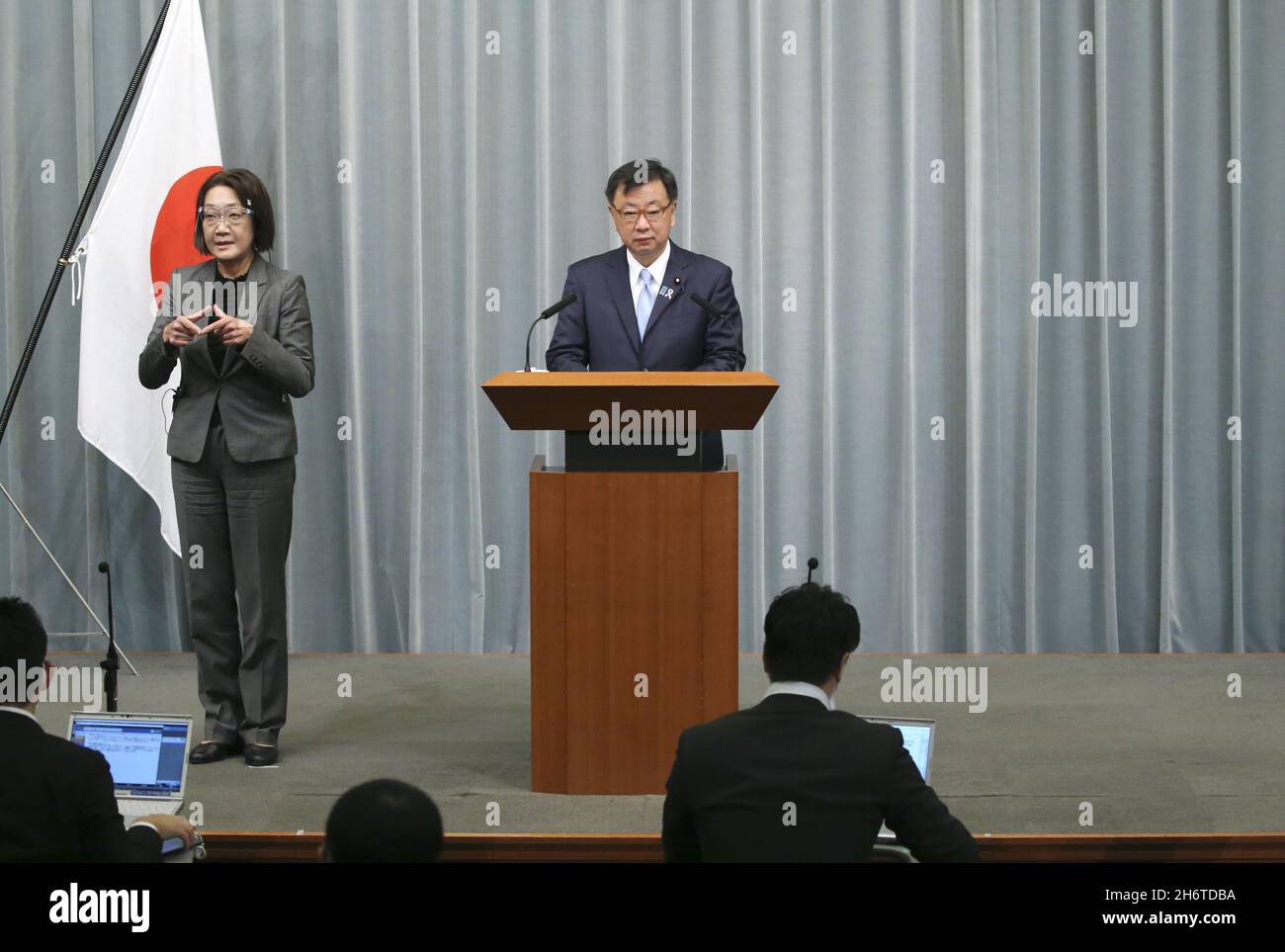 Japanese Chief Cabinet Secretary Hirokazu Matsuno (top R) attends a ...